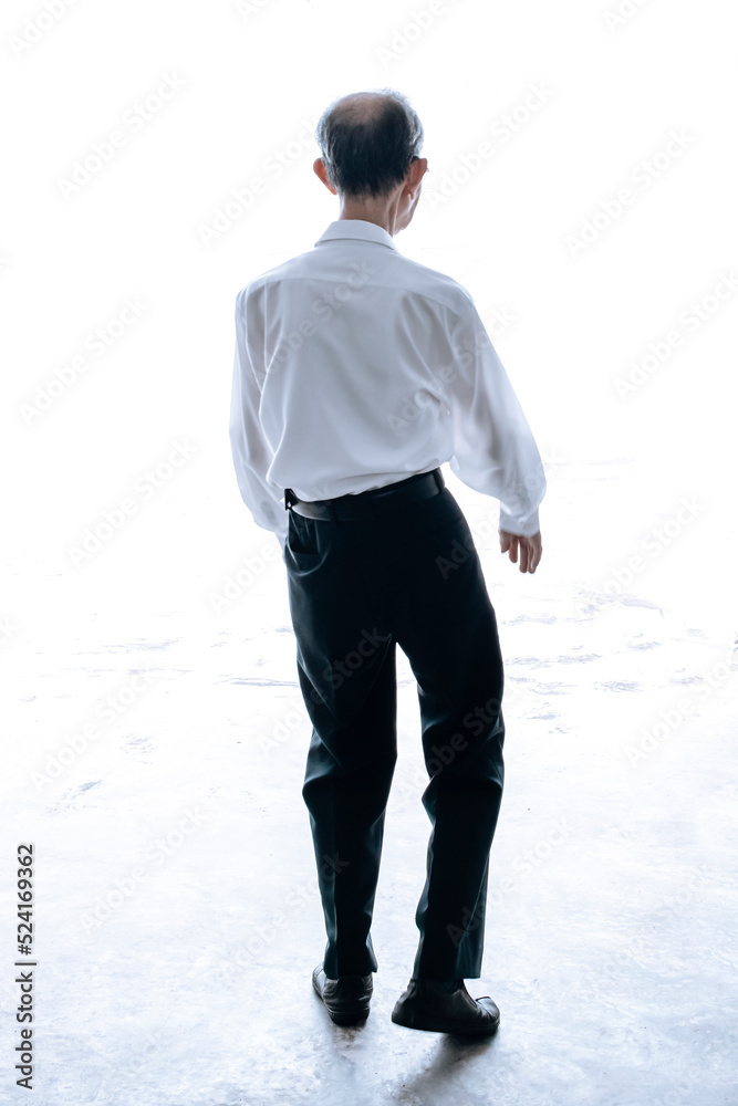 Curvature of the spine on a senior man. Elderly man pictured from the ...