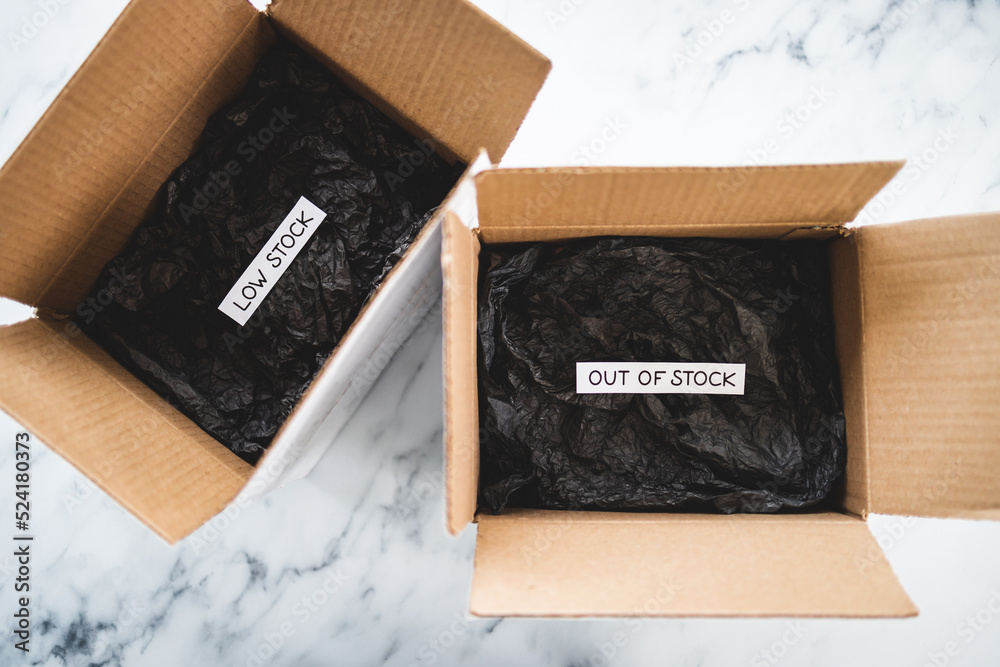 Low stock and out of stock texts inside of empty delivery parcels ...
