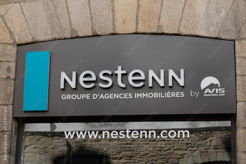 Nestenn sign brand and text logo facade chain wall building office real ...