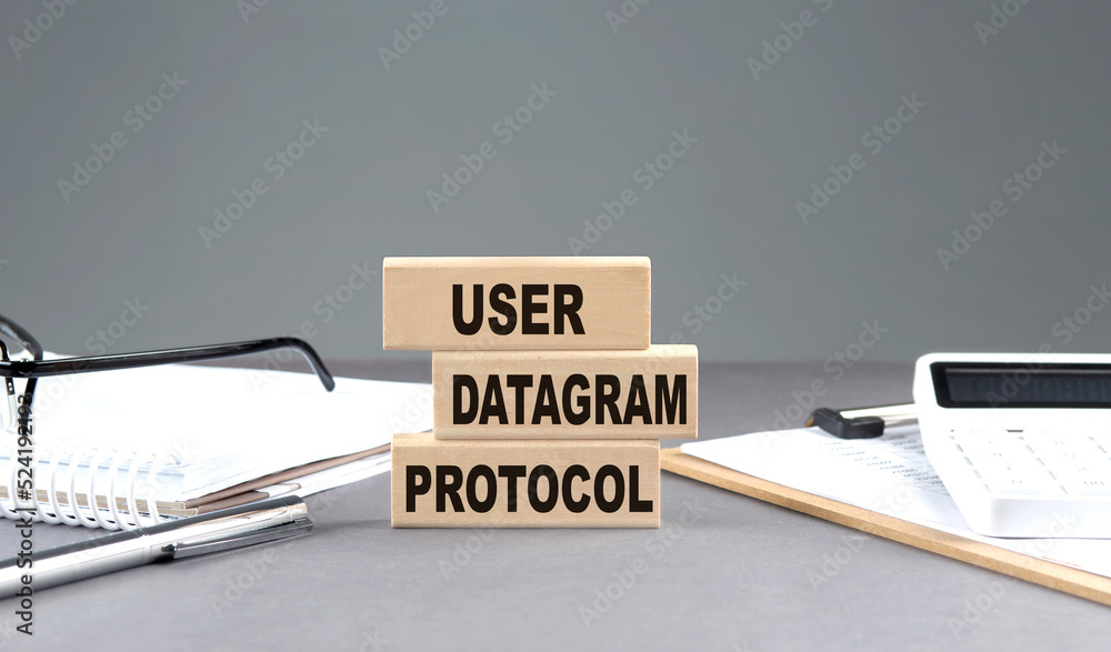 UDP - User Datagram Protocol text on wooden block with notebook,chart ...
