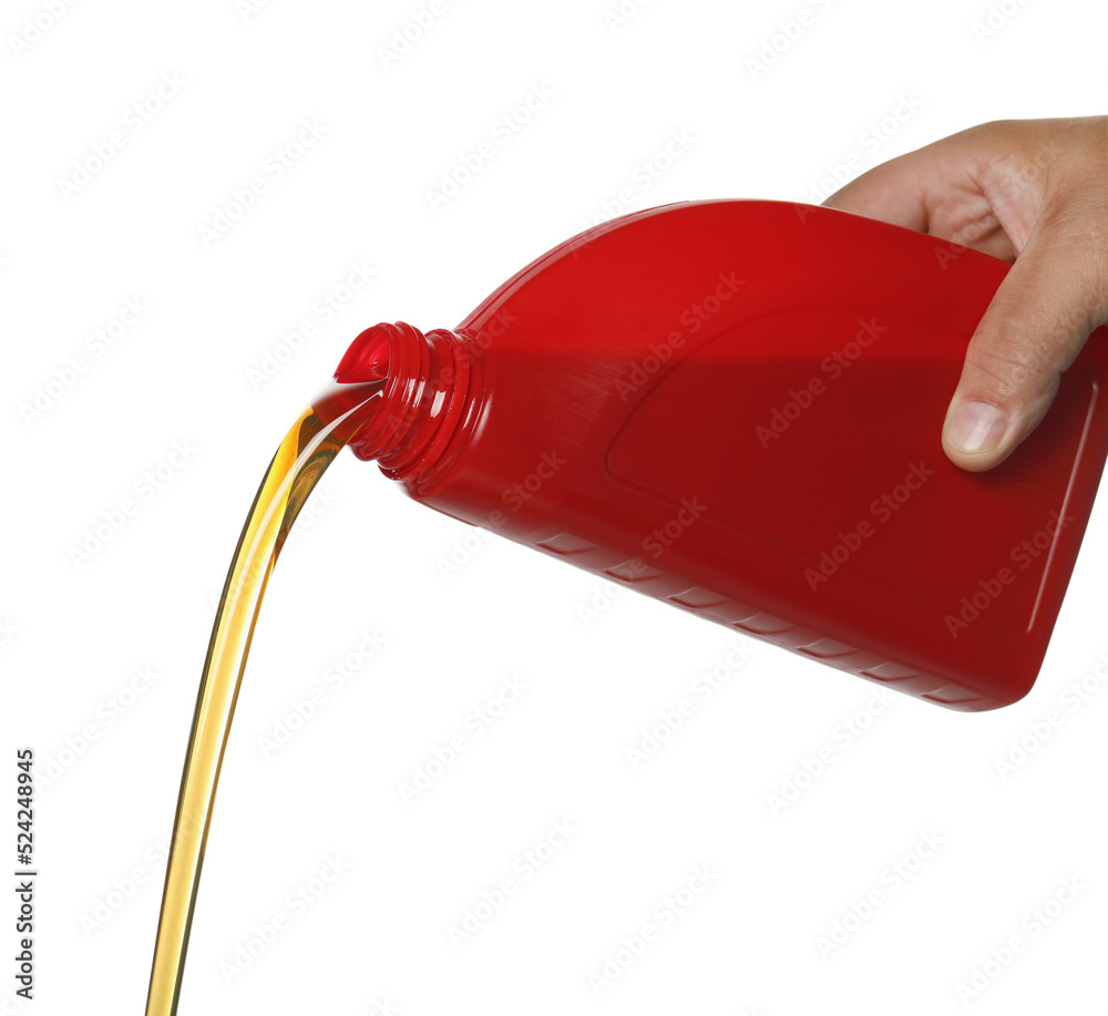 Man pouring motor oil from red container on white background, closeup ...