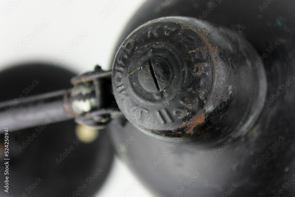 an antique black table lamp from the 20s bauhaus era standing on an old ...