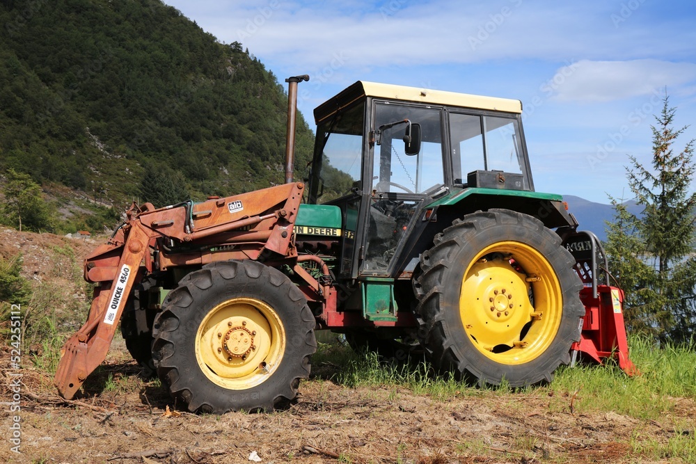 MORE OG ROMSDAL, NORWAY - JULY 26, 2020: John Deere tractor with a ...