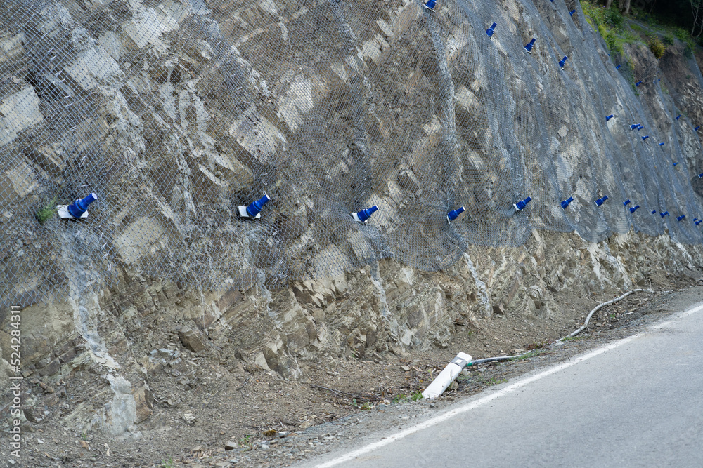 Reinforcing mountain slope with metal mesh and concrete reinforcement ...