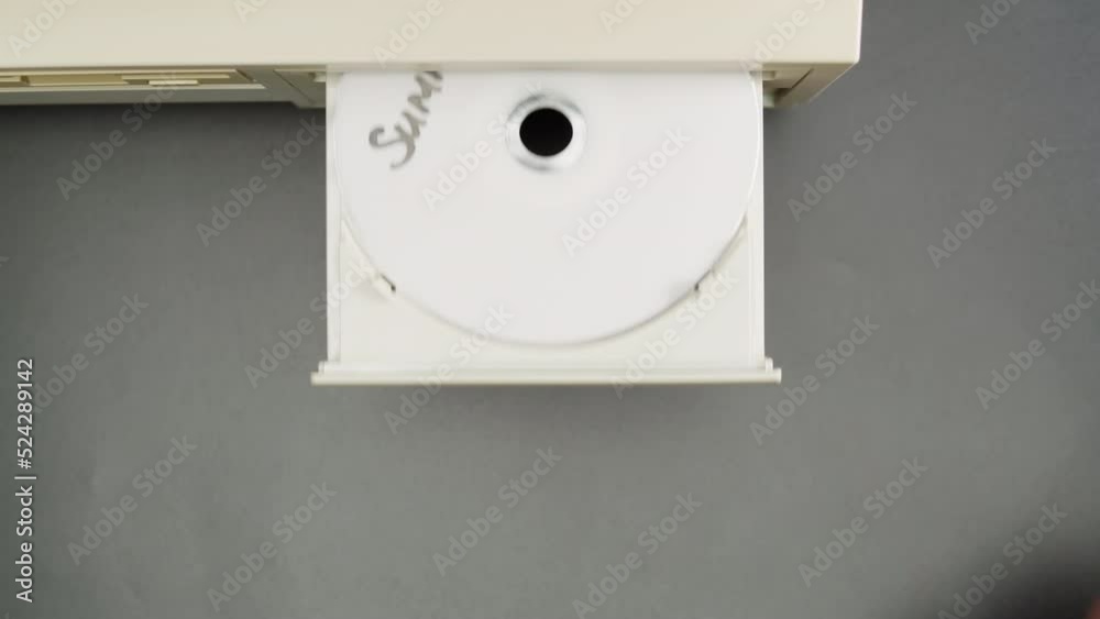 Using CD circle disk close-up. Old dvd player, disc drive top view ...
