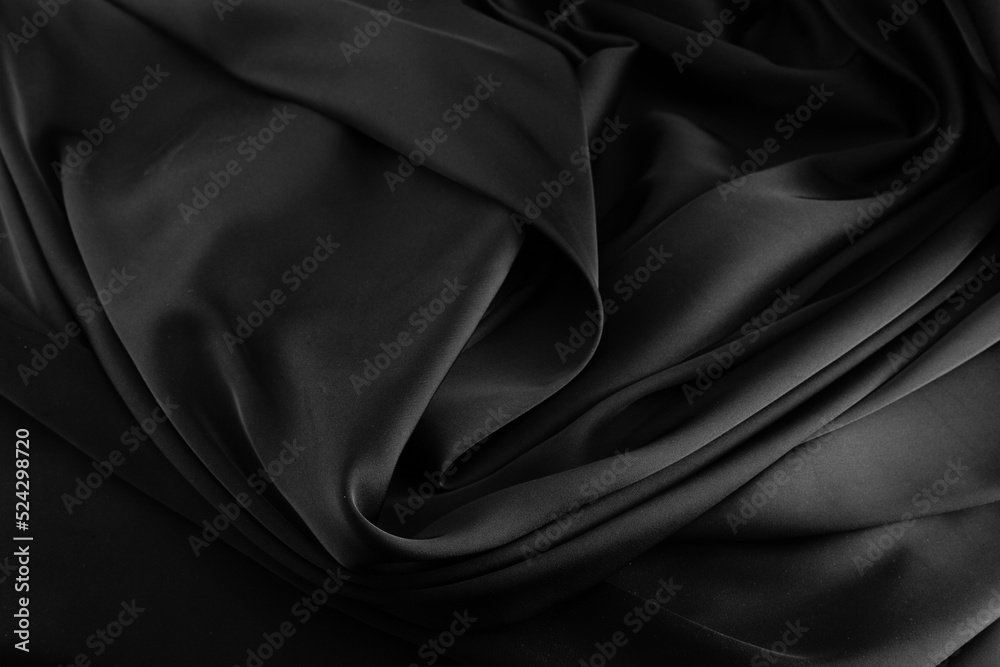 Folds of black silk fabric. Stock Photo | Adobe Stock