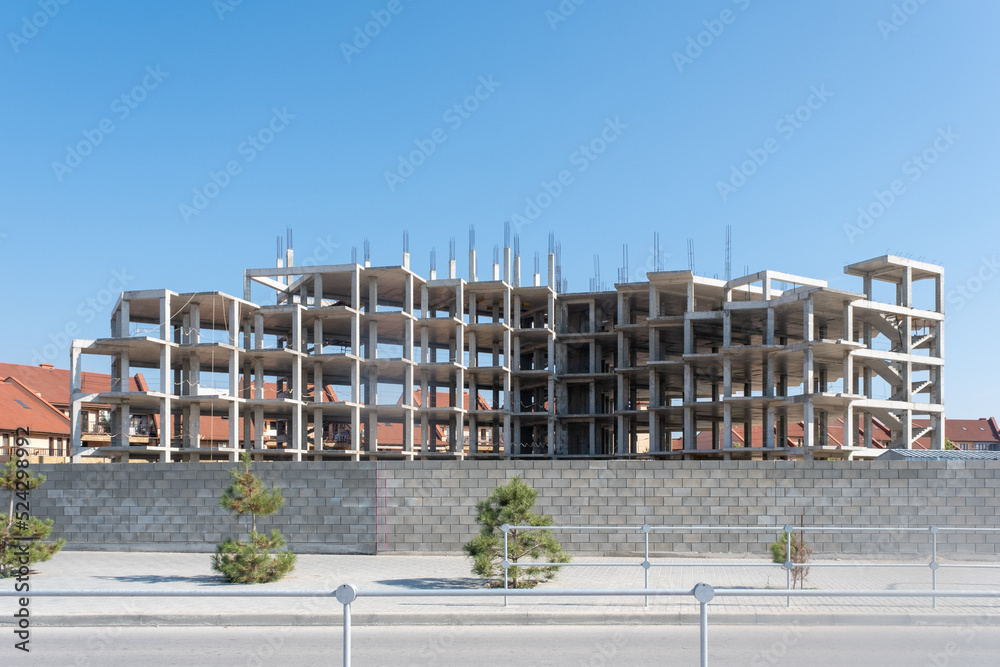 Construction of a multi-storey building. Concrete floors are clearly ...