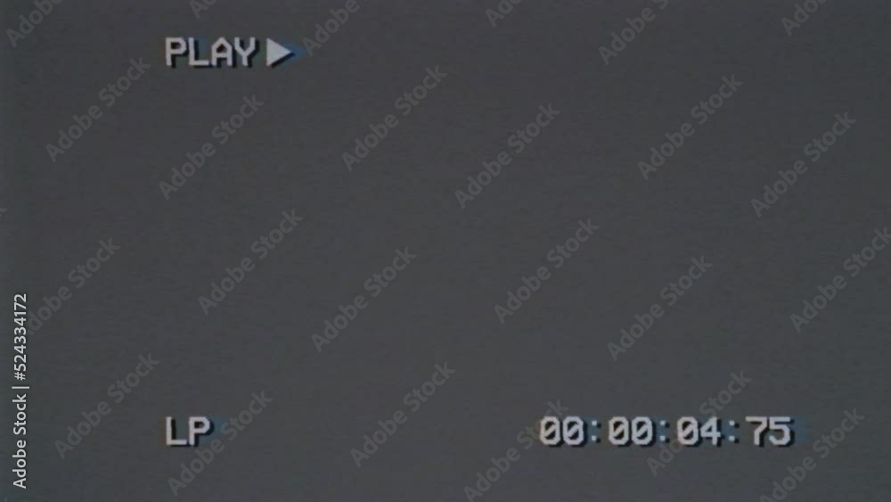 Old gray screen with PLAY text and timecode. VHS glitches and static noise background. Old TV ...