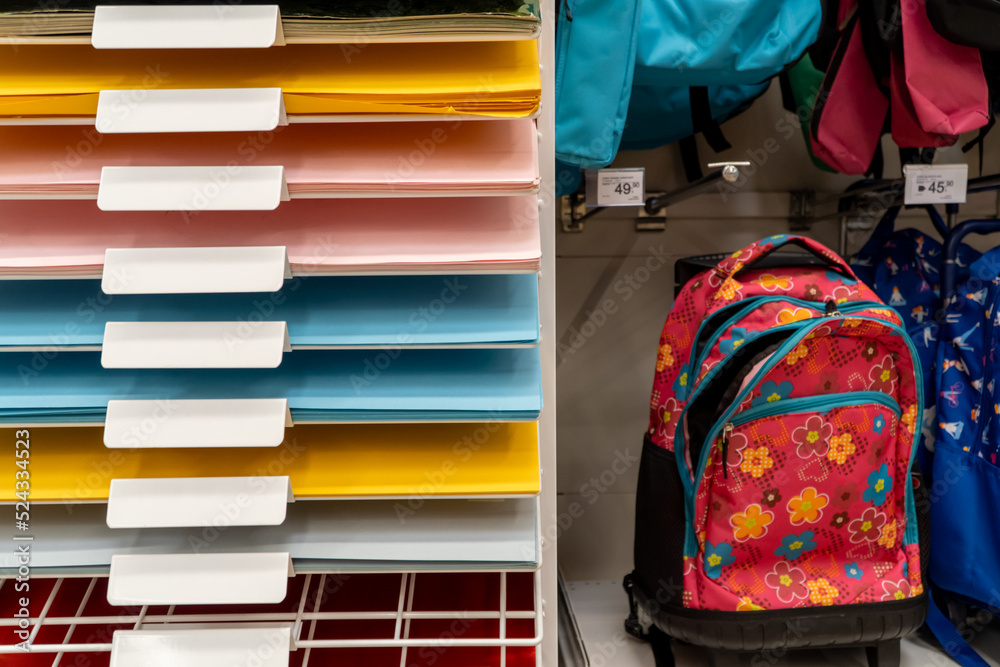 school backpacks and coloured papers on supermarket display for the ...