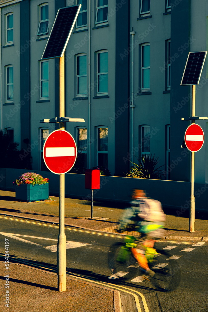 Blurred bicyclist passing by no entry sign Stock Photo | Adobe Stock