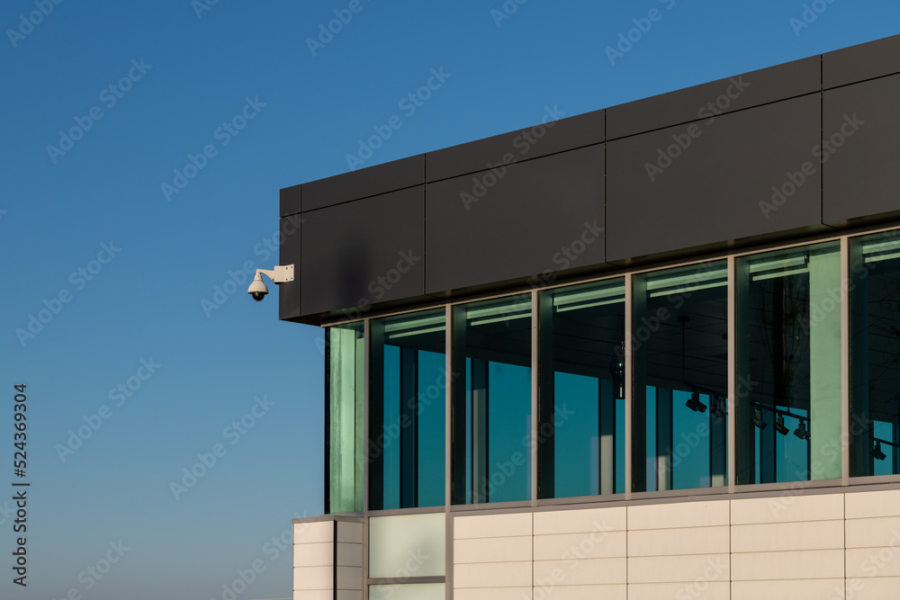 The exterior corner of a commercial business building. The walls are ...