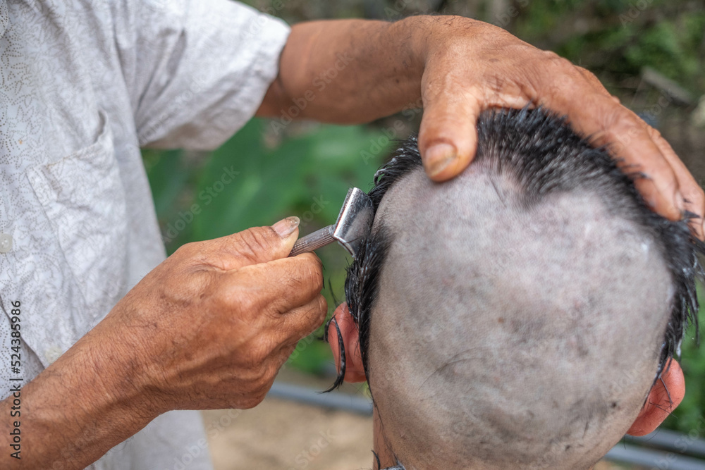 Buddhist monks shave their hair to be ordained a priest.Ceremony remove ...