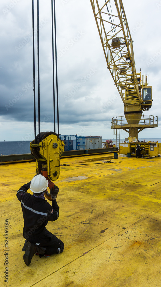 Mechanical engineer inspector is inspecting lifting equipment of ...