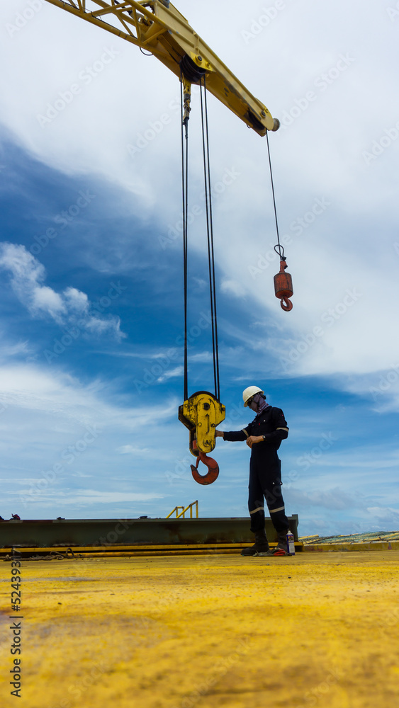 Mechanical engineer inspector is inspecting lifting equipment of ...