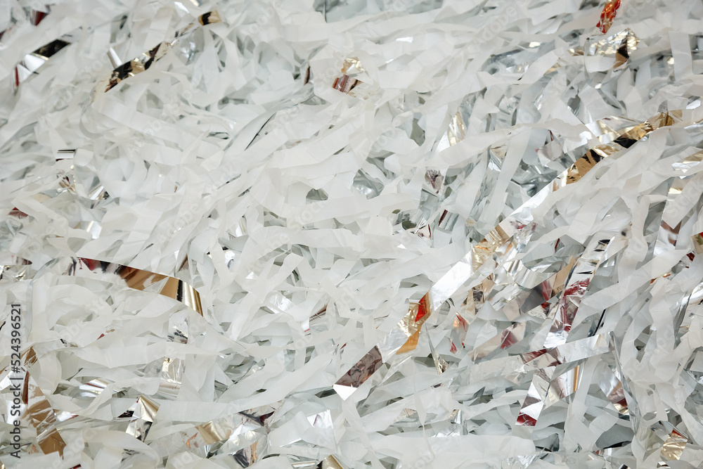 Textured background of shredded paper, top view of many strips of white ...
