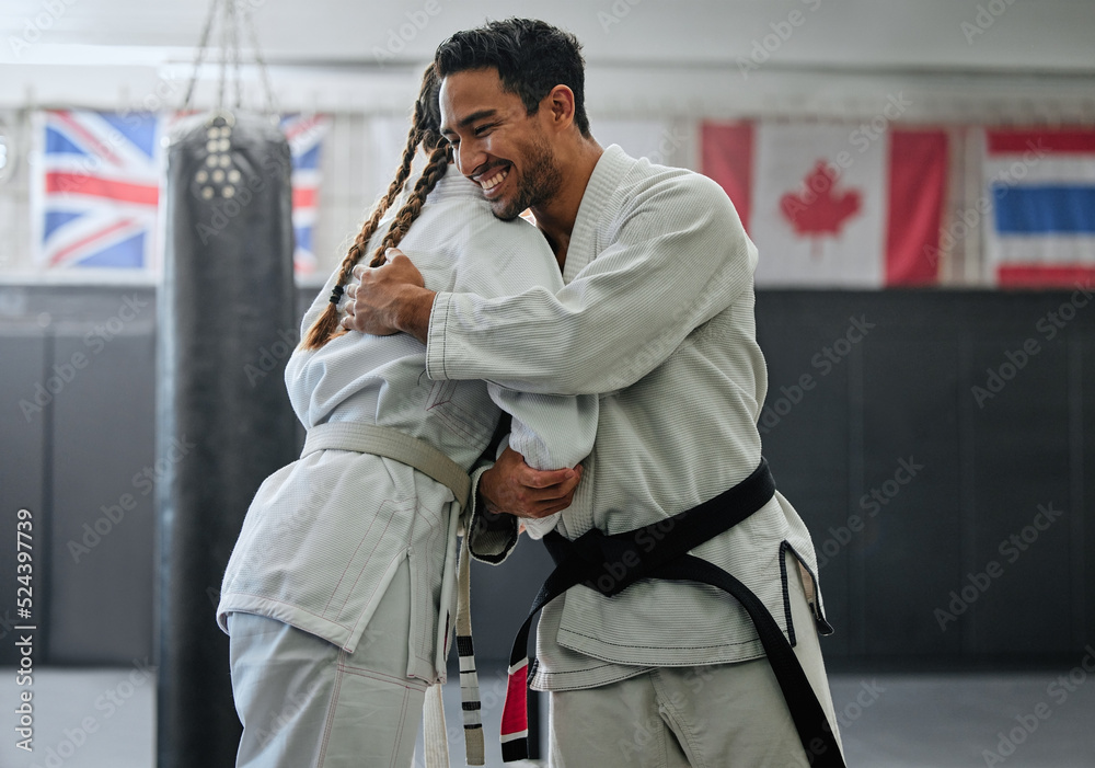. Karate trainer giving hug to female student for motivation, coach ...