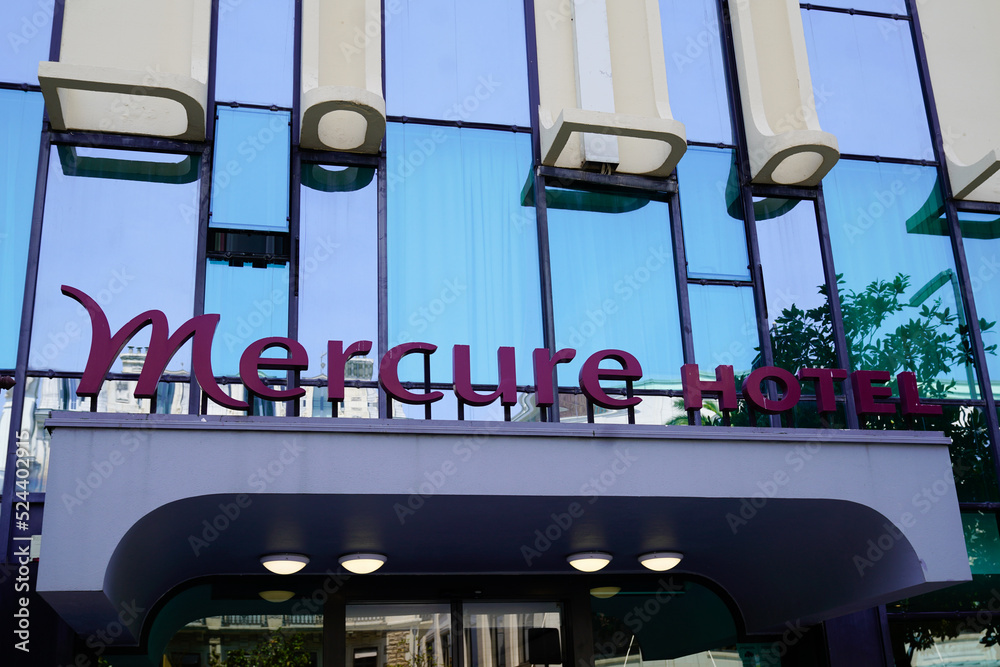 mercure hotel text brand hostel and logo sign entrance building wall ...