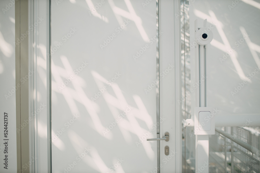 Face recognition system with camera in front of office in white ...