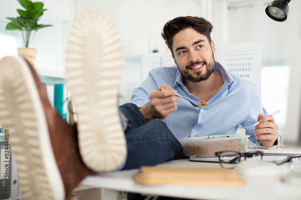 architect designing with computer feet up on desk Stock Photo | Adobe Stock