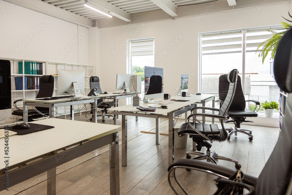 Interior of a modern light small company office. Workspace, office ...