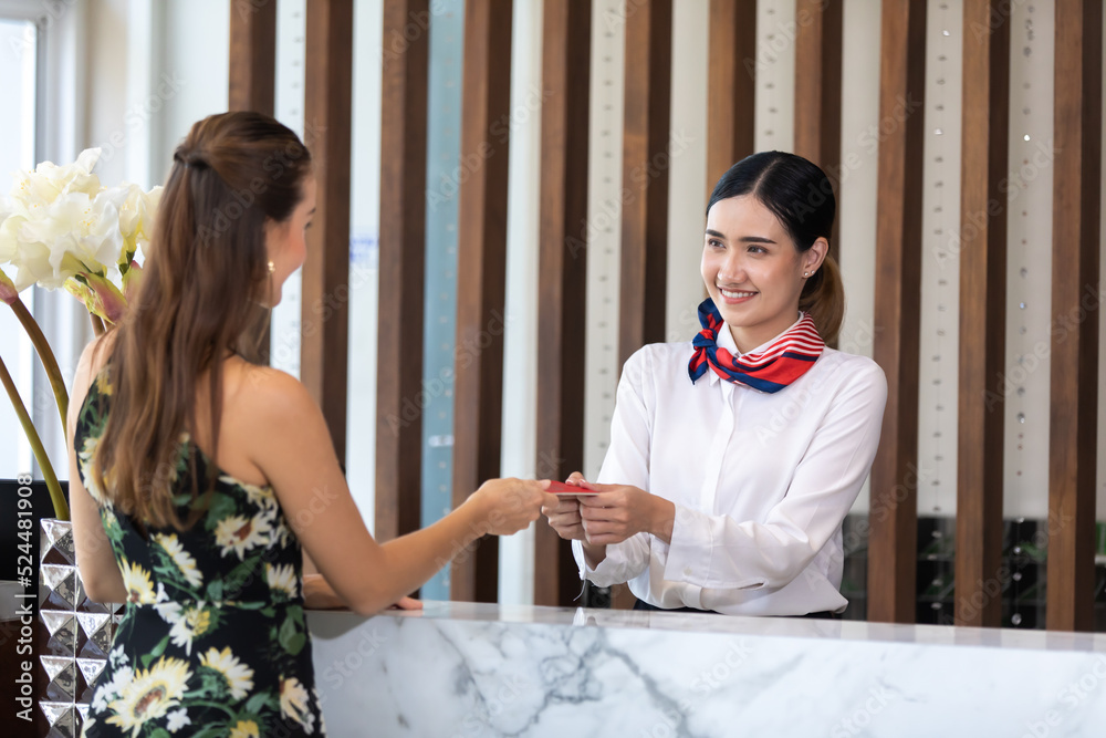 beautiful young asian woman receptionists working at a reception desk ...