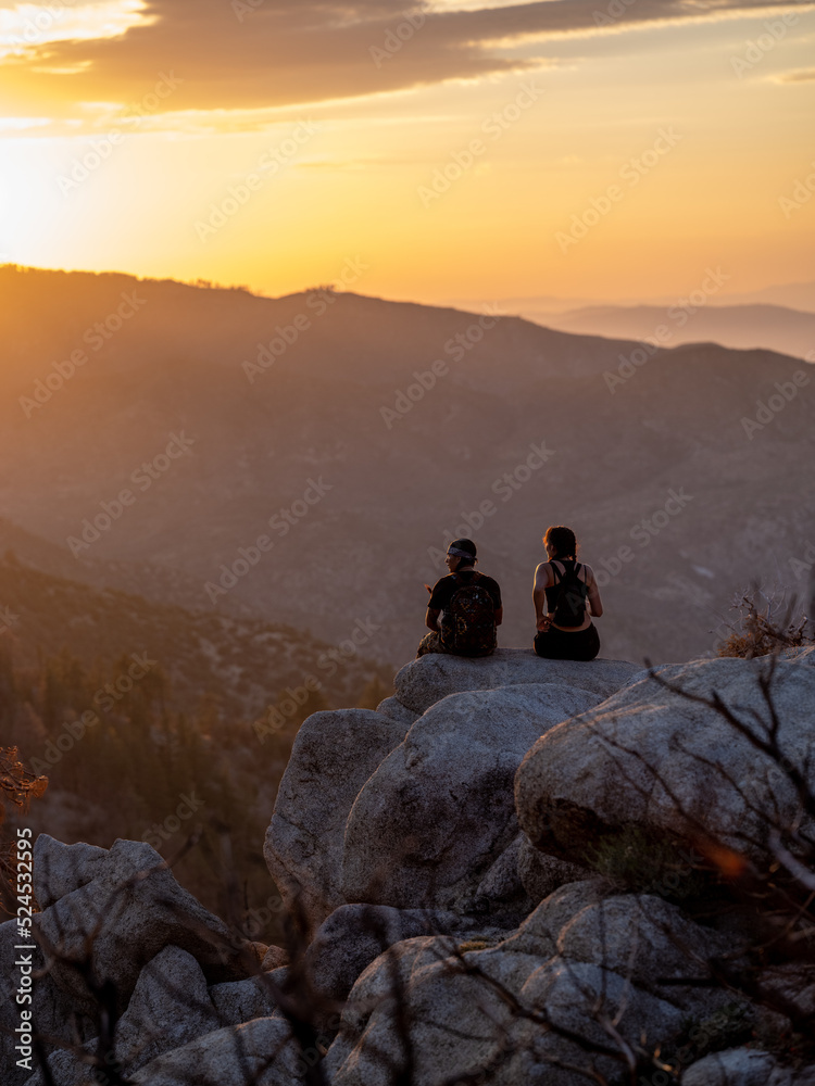 Vertical image of young native friends admiring the sun setting Stock ...