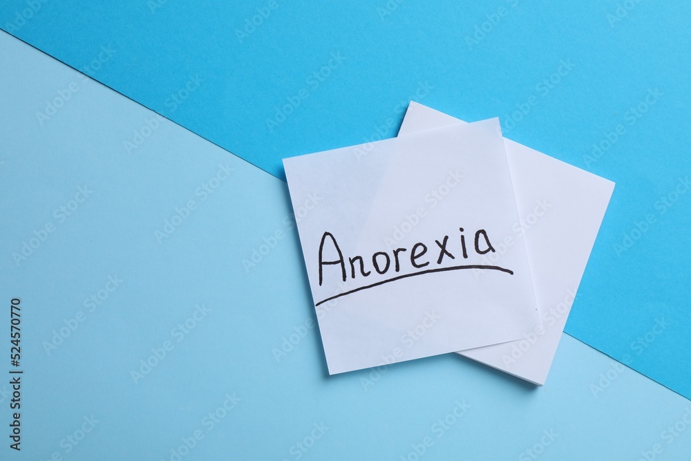 Poster Note papers with word Anorexia on light blue background, flat ...