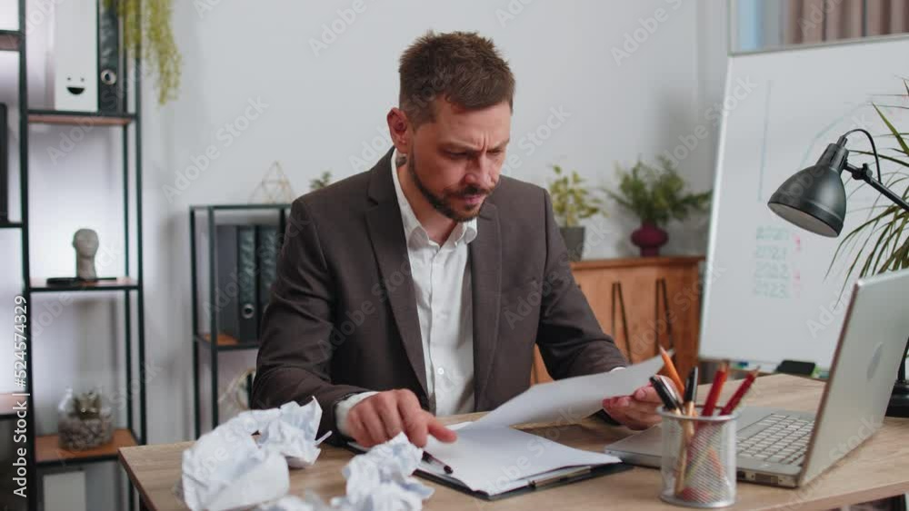 Angry furious man working at home office throwing crumpled paper ...