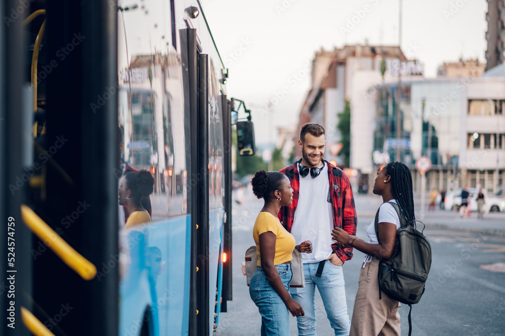 Multiracial group of people waiting for a public transport on a bus ...