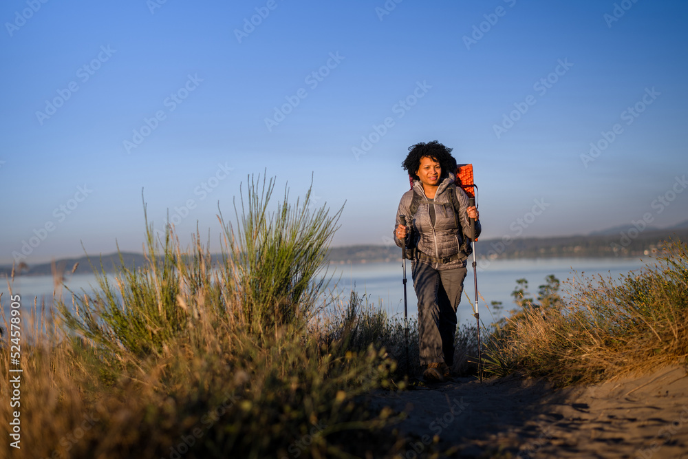 U.S. Army female soldier putting in the miles with an early morning ...