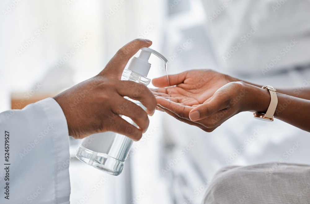 Doctor giving patient hand sanitizer for protection, hygiene and ...