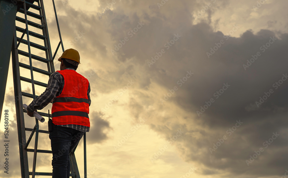 Engineer is going up the stairs and working on the high ground in ...