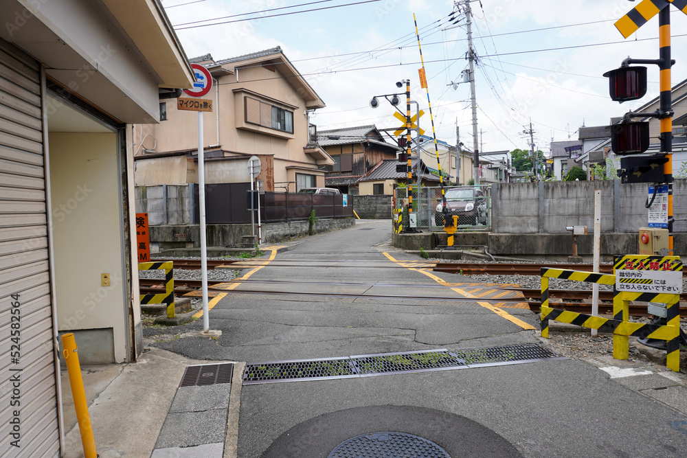 Local train roadway and grade crossing in Uji, Kyoto, Japan Stock Photo ...