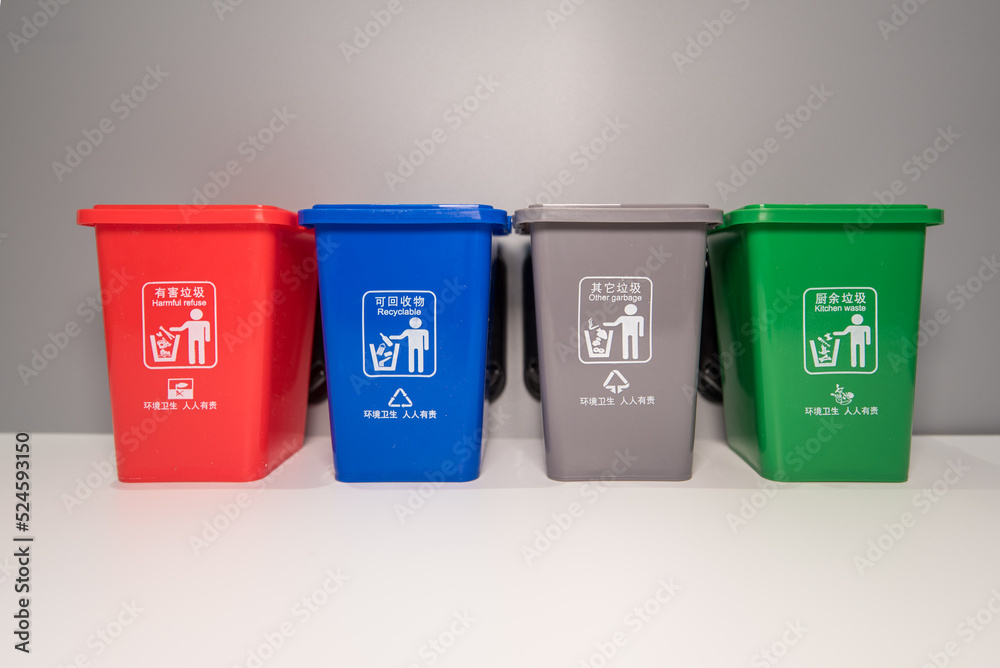 Four trash cans with symbols of waste sorting, sustainable development ...