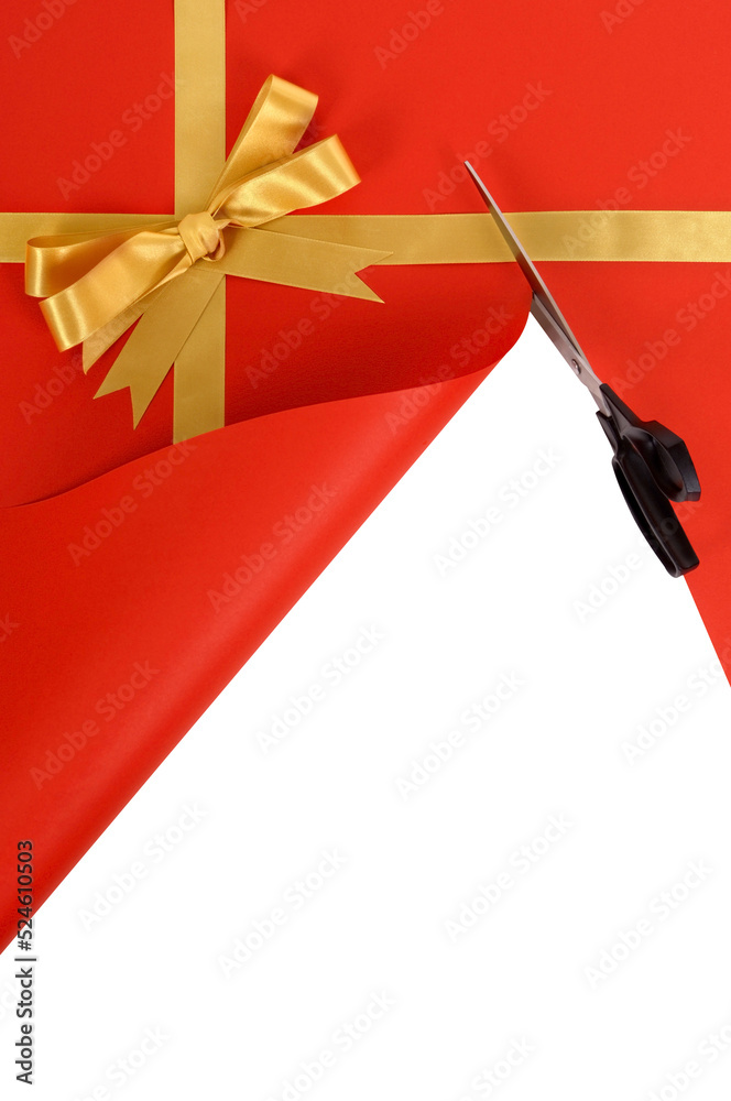 Scissors cutting Christmas gift open red paper gold bow isolated ...