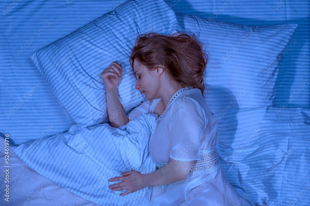 Woman sleeping in bed at home. Deep restful sleep. Lady with long brown ...