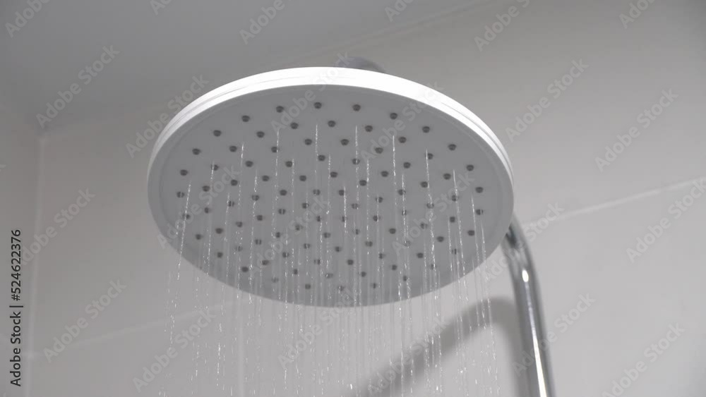 Fresh shower with splashes of water droplets. Water flows from shower ...