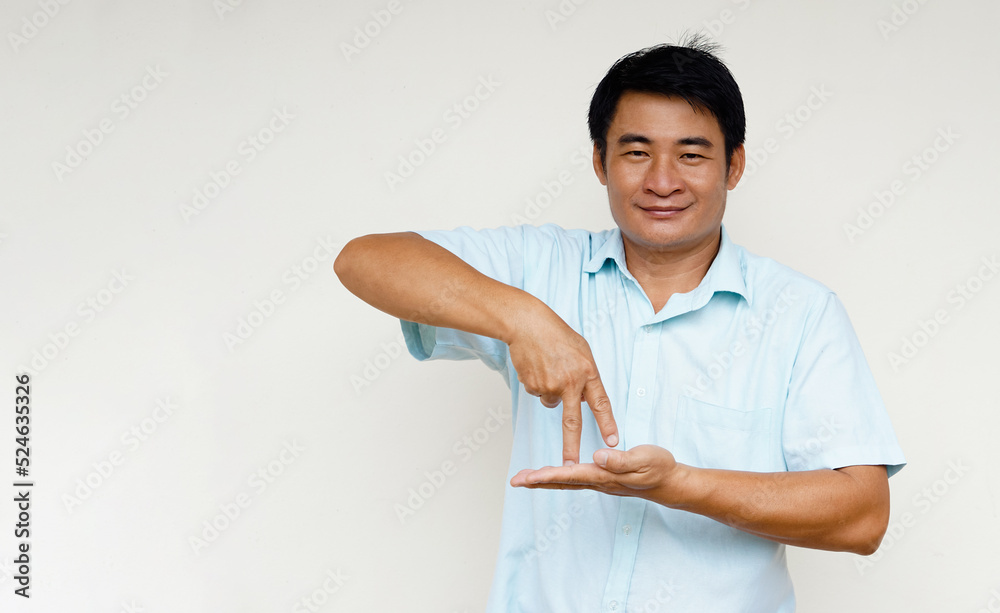 Asian man teacher demonstrate body sign language. Two fingers down on ...