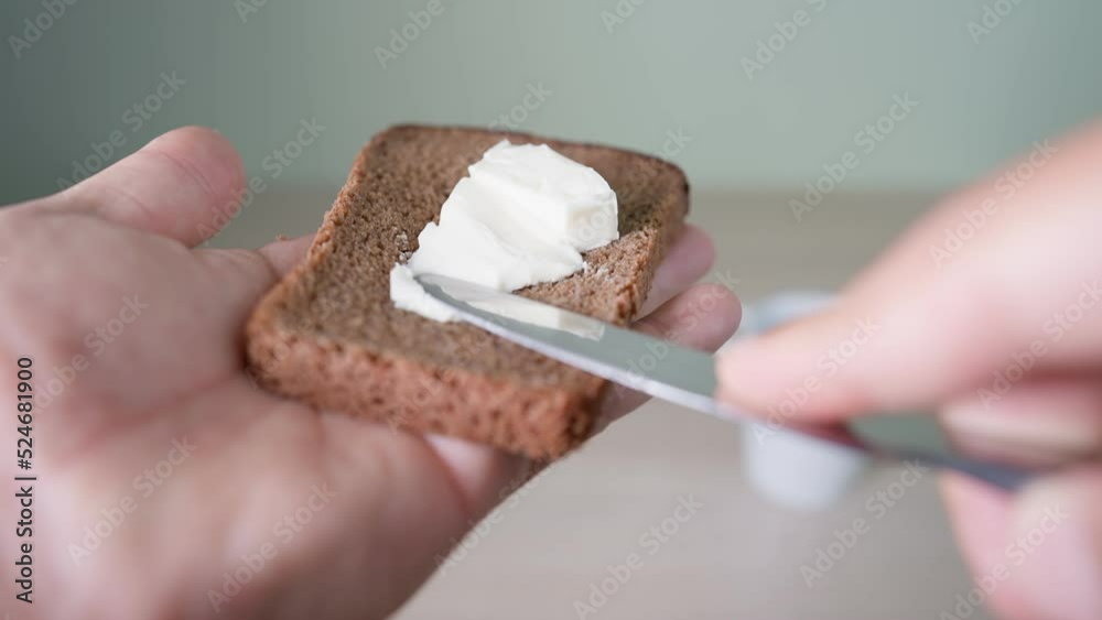 Close-up from the First Person. Male Hands Smear Black Bread with ...