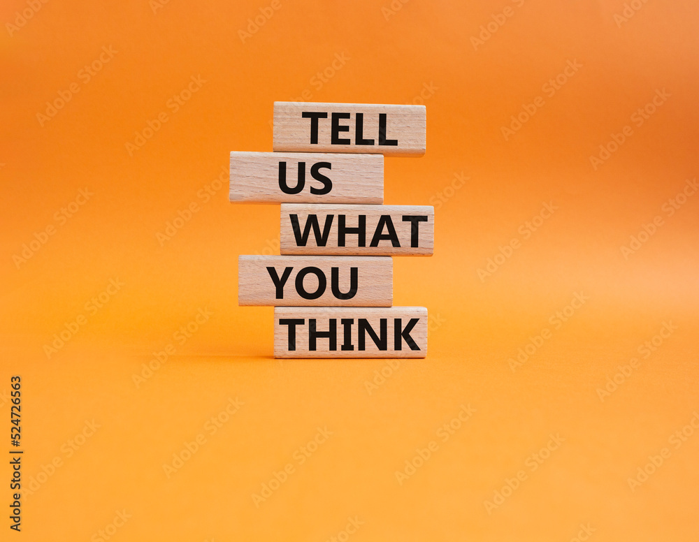 Tell us what you think symbol. Wooden blocks with words Tell us what ...