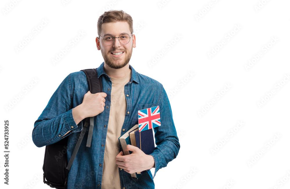 Positive young student with books, backpack and UK flag standing over ...