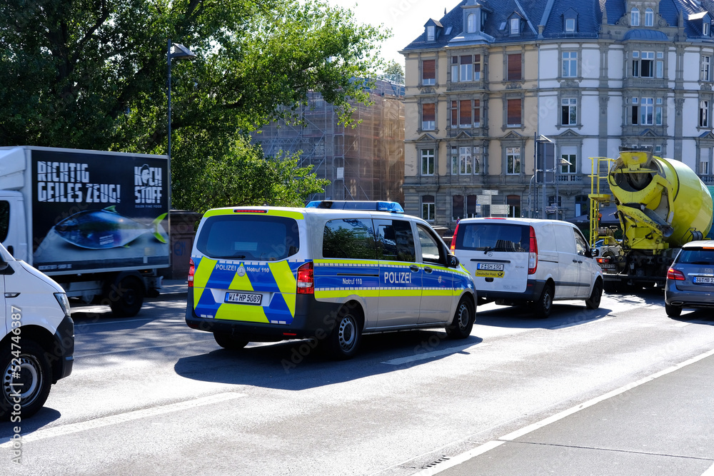 police car on streets of germany, law enforcement officers guarding ...