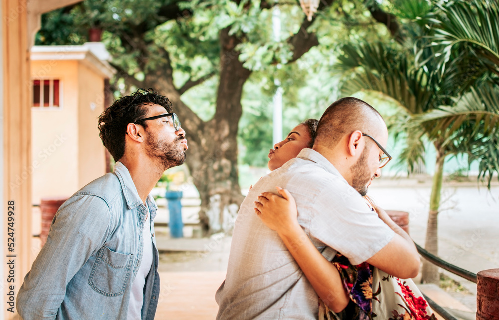 Unfaithful girlfriend hugging her boyfriend outdoors and secretly ...