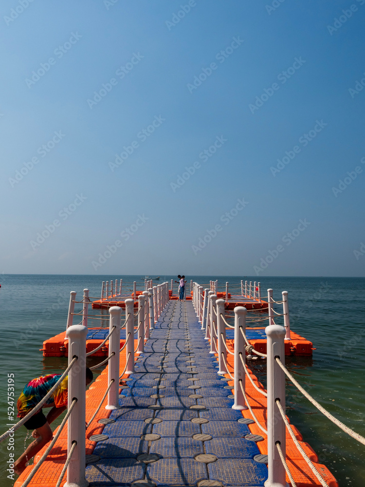 Floating piers along shore are place for tourists walk. Mooring boat ...
