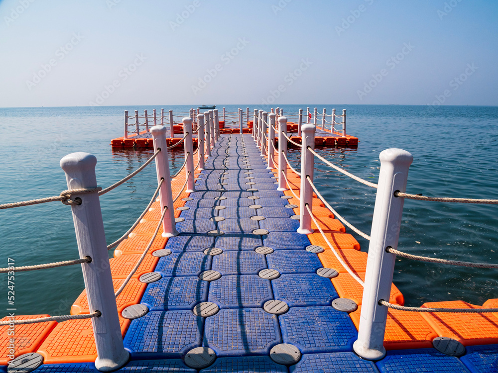 Floating piers along shore are place for tourists walk. Mooring boat ...