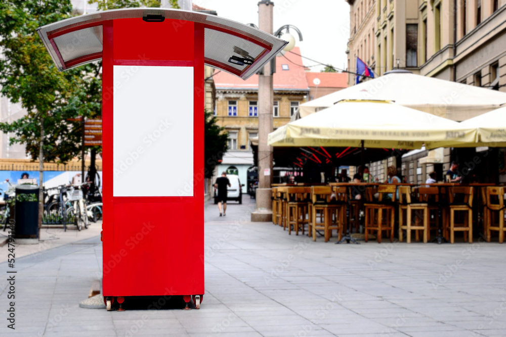 red street vedor kiosk with empty white advertising commercial panel ...