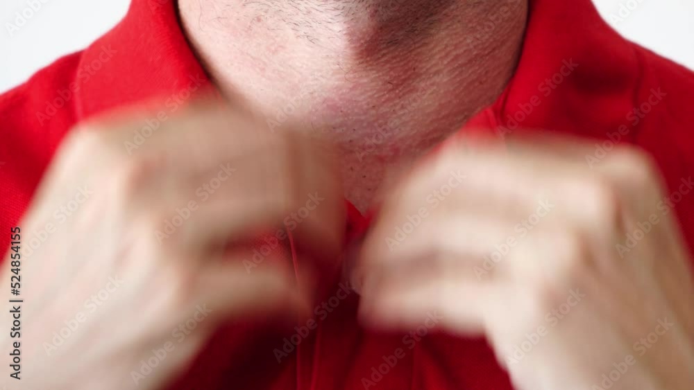 Vidéo Stock Hands buttoning a polo shirt not completely. Close-up of ...