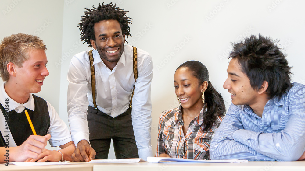 Teenage Students, friendly teacher. A friendly smile from a class tutor ...