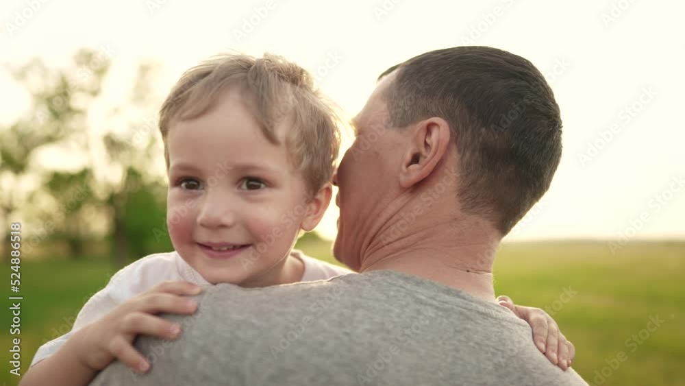 son hugging dad in the park. happy family a father day kid dream ...
