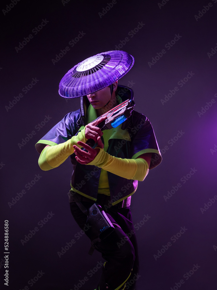 Cyborg killer in an Asian hat, a futuristic character with a gun in his ...